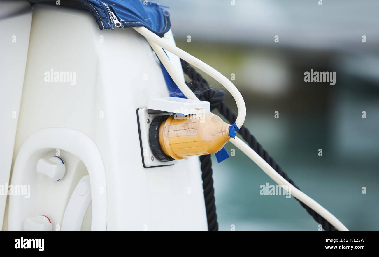 Electrical power socket bollard on pier. Charging station for boats in ...
