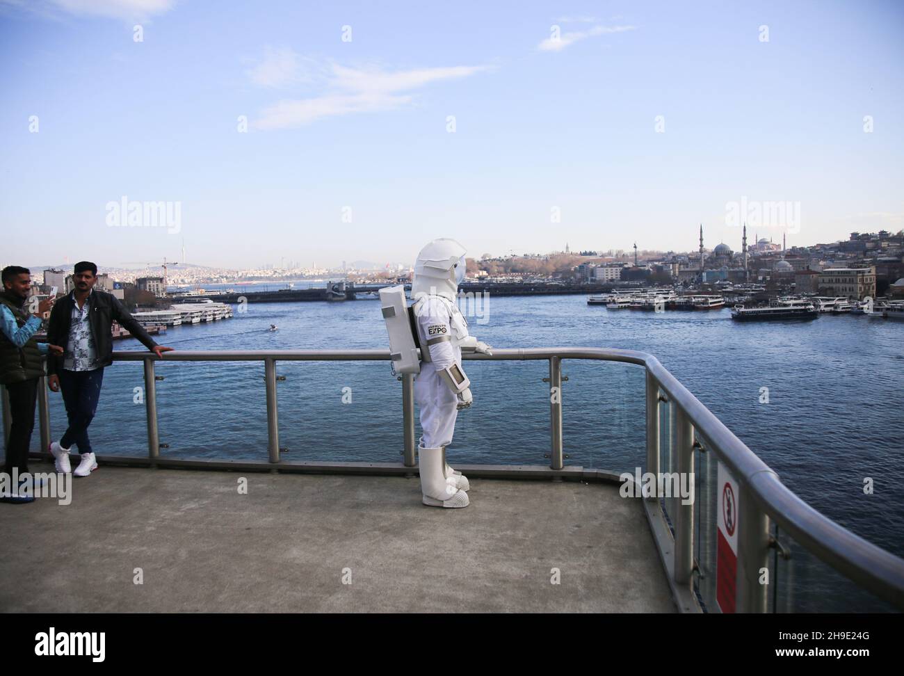 A man dressed as an astronaut is seen at the Golden Horn metro station ...