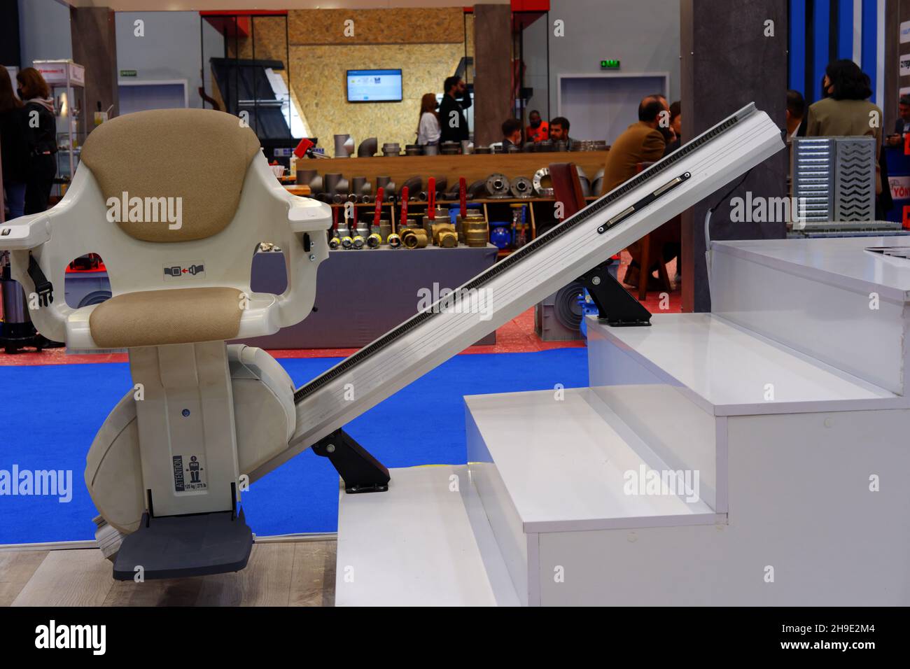 Stair lift for disabled people at exhibition indoor Stock Photo - Alamy