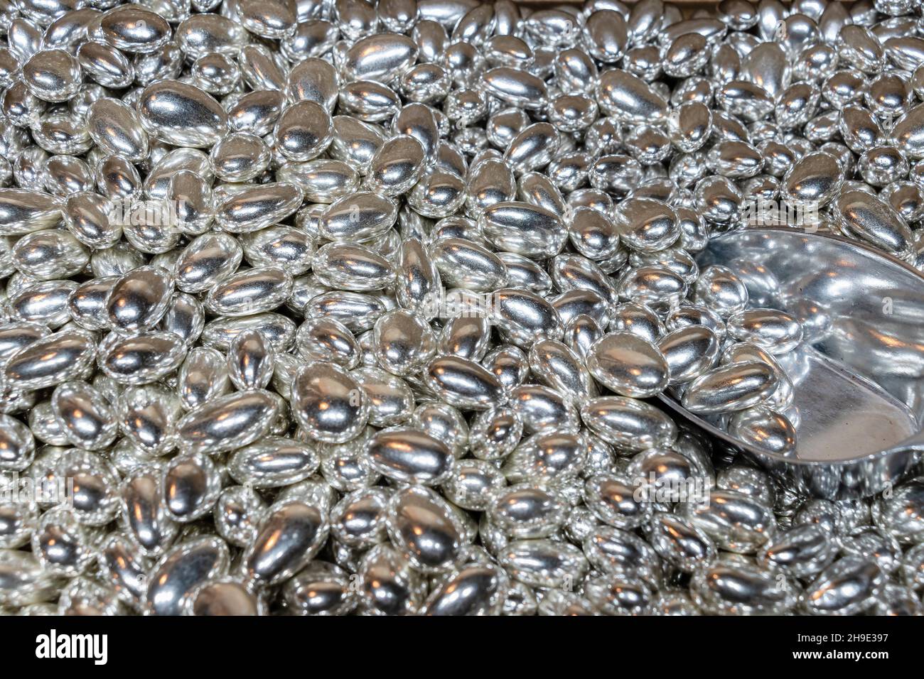 Sale by weight of chocolate candies of silver colour Stock Photo - Alamy