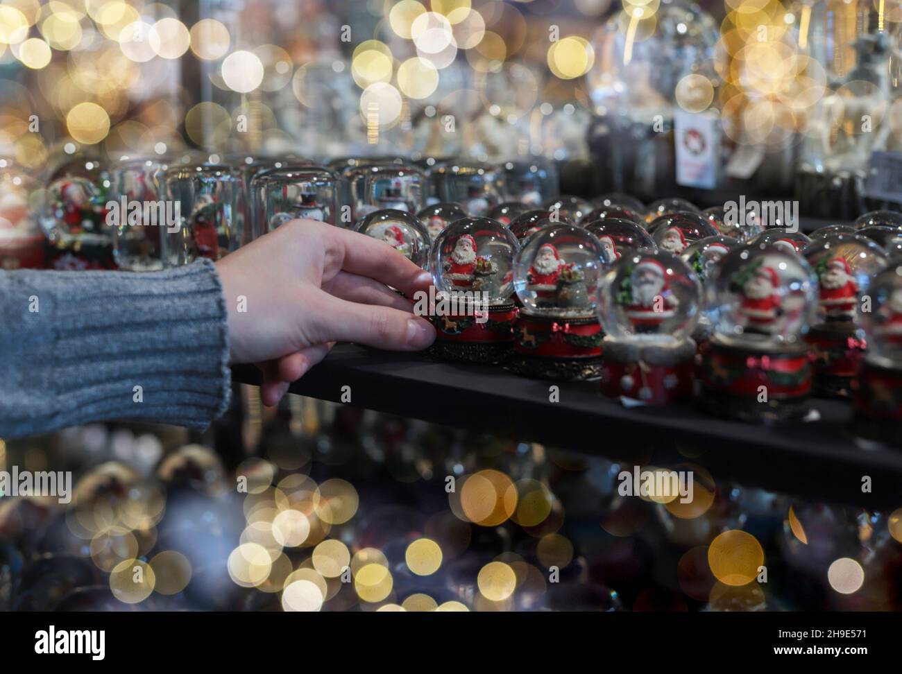 Christmas shopping concept. Hand choosing and buying xmas toys from ...