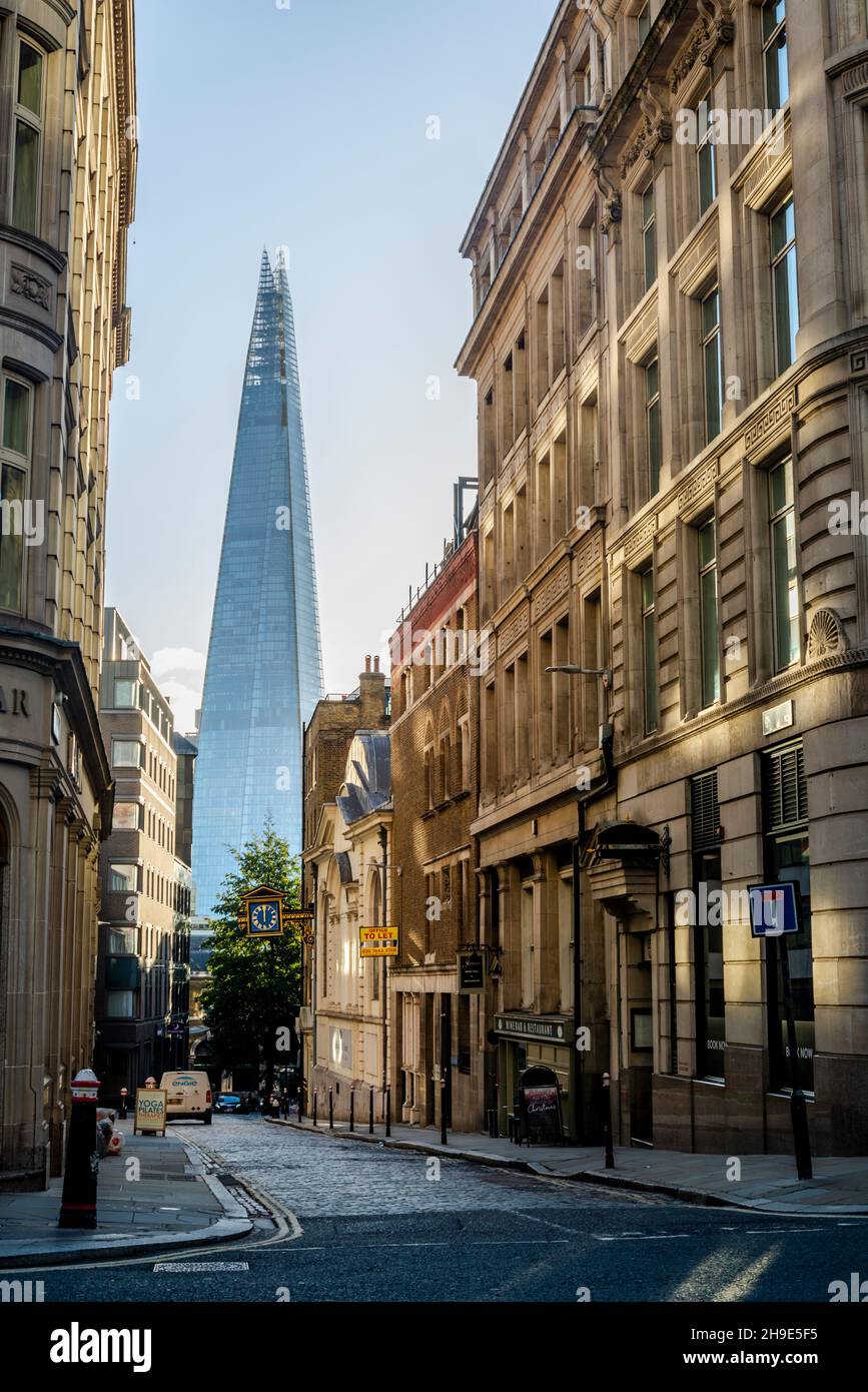 The Shard seen from a street in the City of London, London, England, UK ...