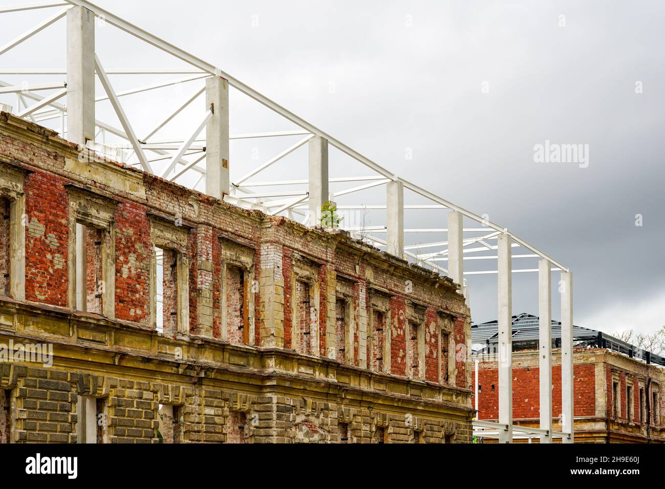 integration of the facade of the old brick building into a new modern ...