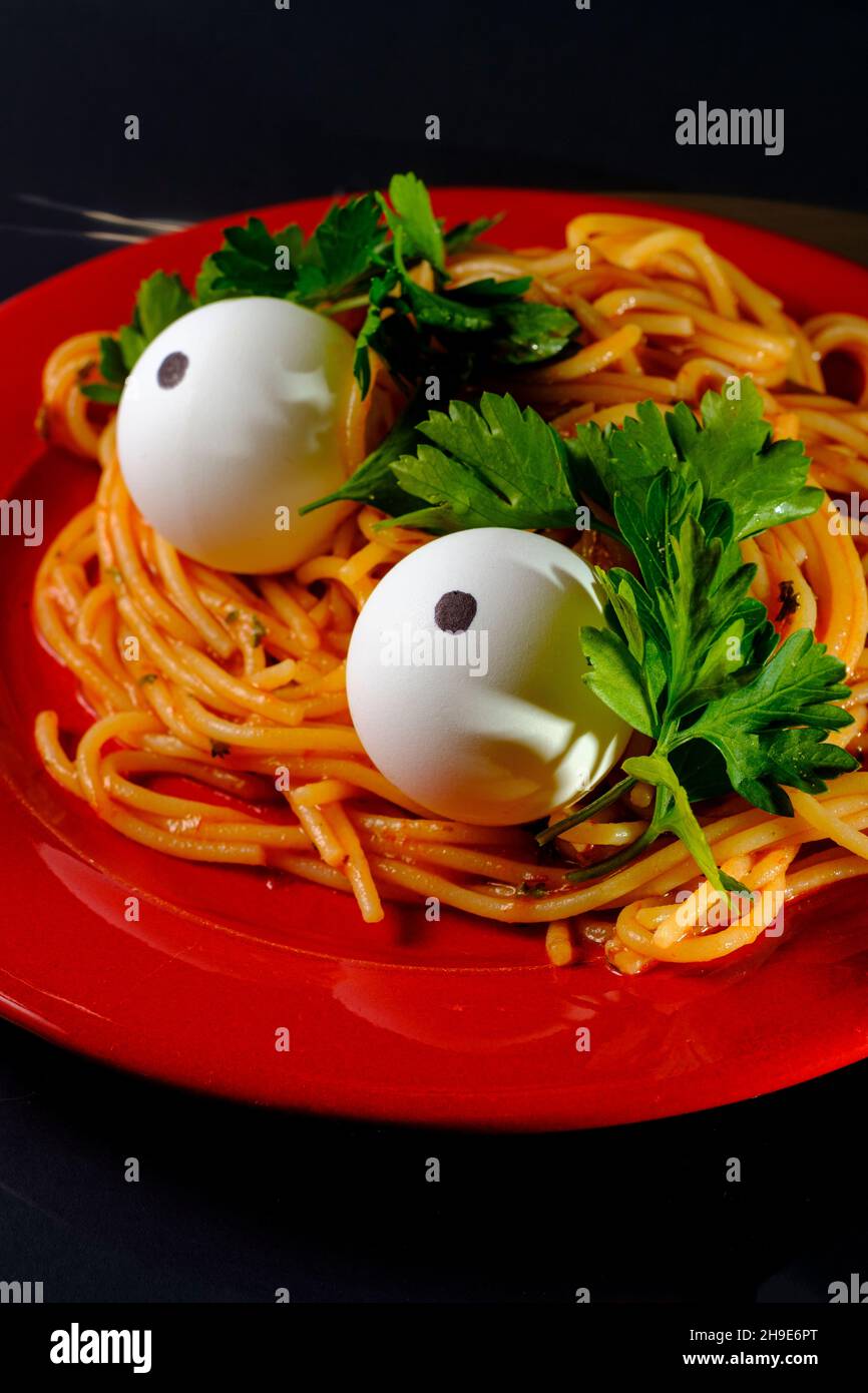 Spaghetti alien monster with eyeballs scared of being eaten Stock Photo ...