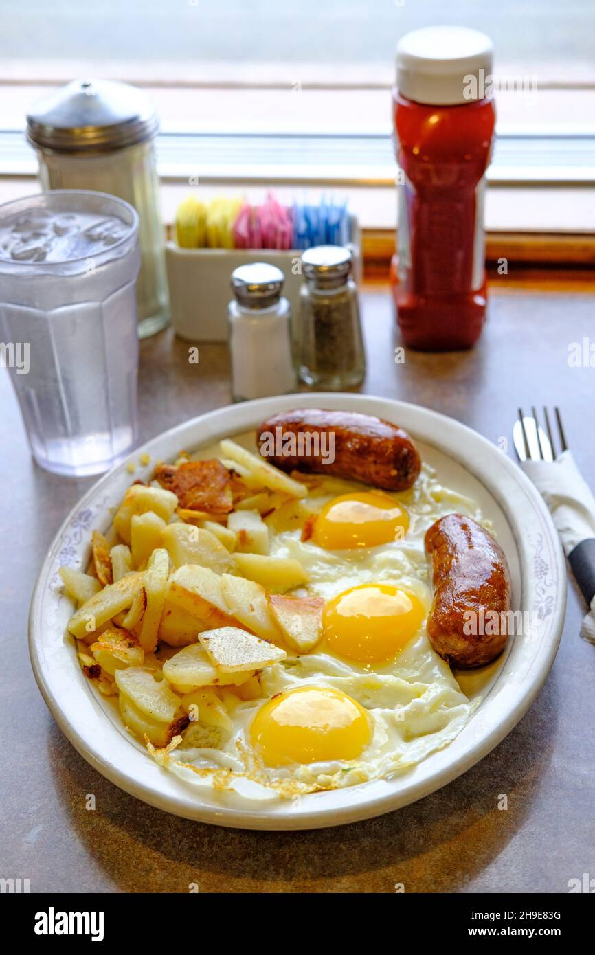 Complete American diner breakfast three sunny side up fried eggs ...