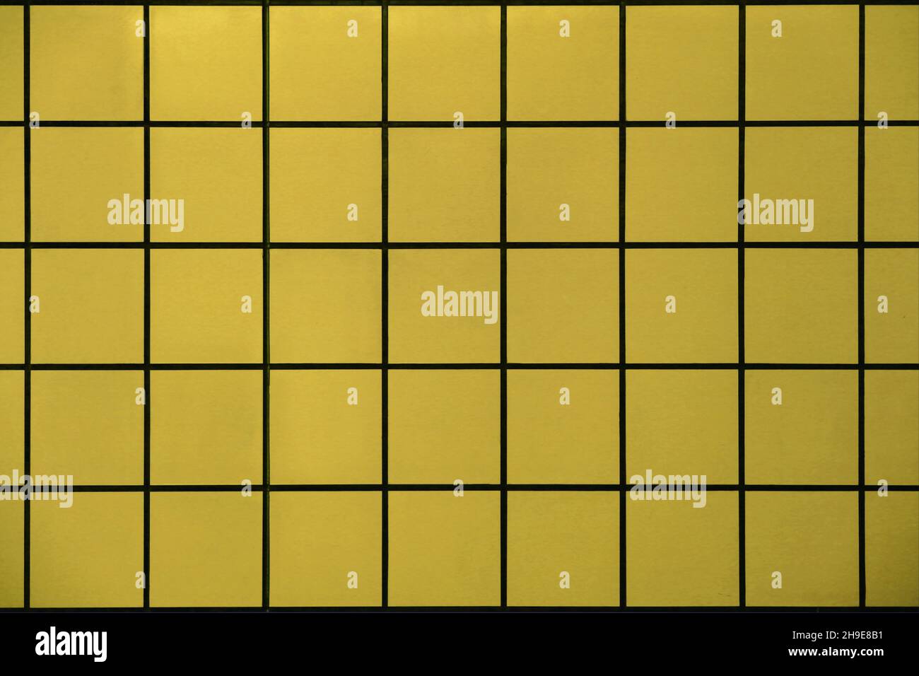 Yellow tile wall with geometric pattern as background material Stock ...