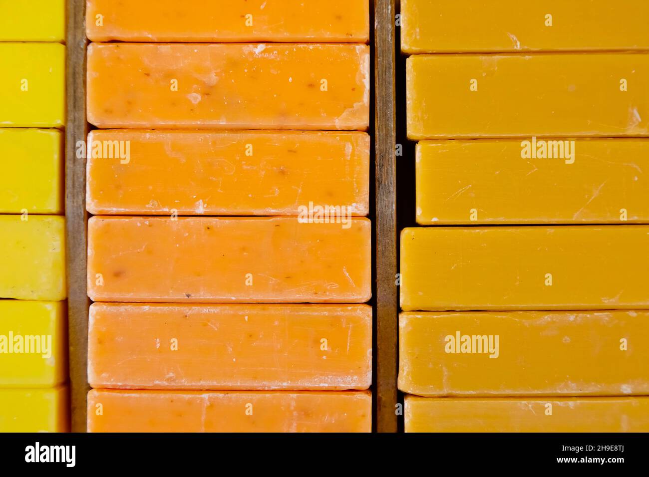 The soap cubes, are stacked in piles, created a background. Various ...