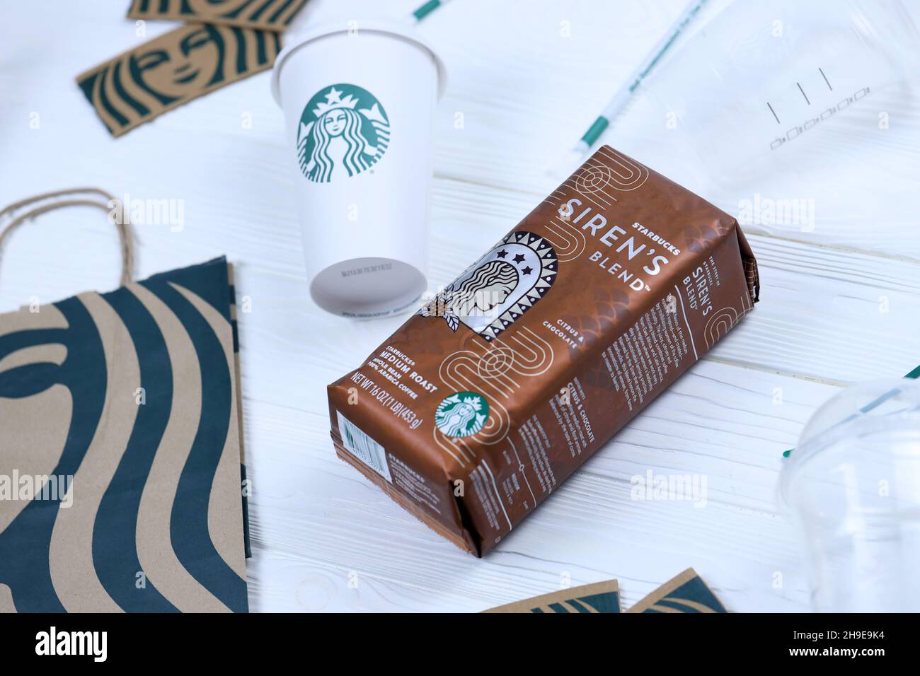 KHARKOV, UKRAINE - MARCH 15, 2021: Starbucks production on white wooden ...