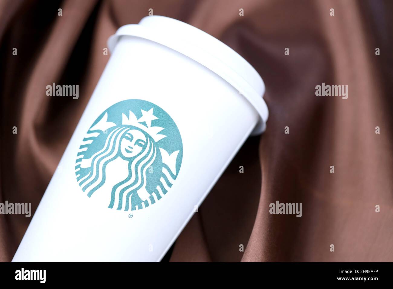 KHARKOV, UKRAINE - MARCH 15, 2021: Starbucks cup with green logo ...