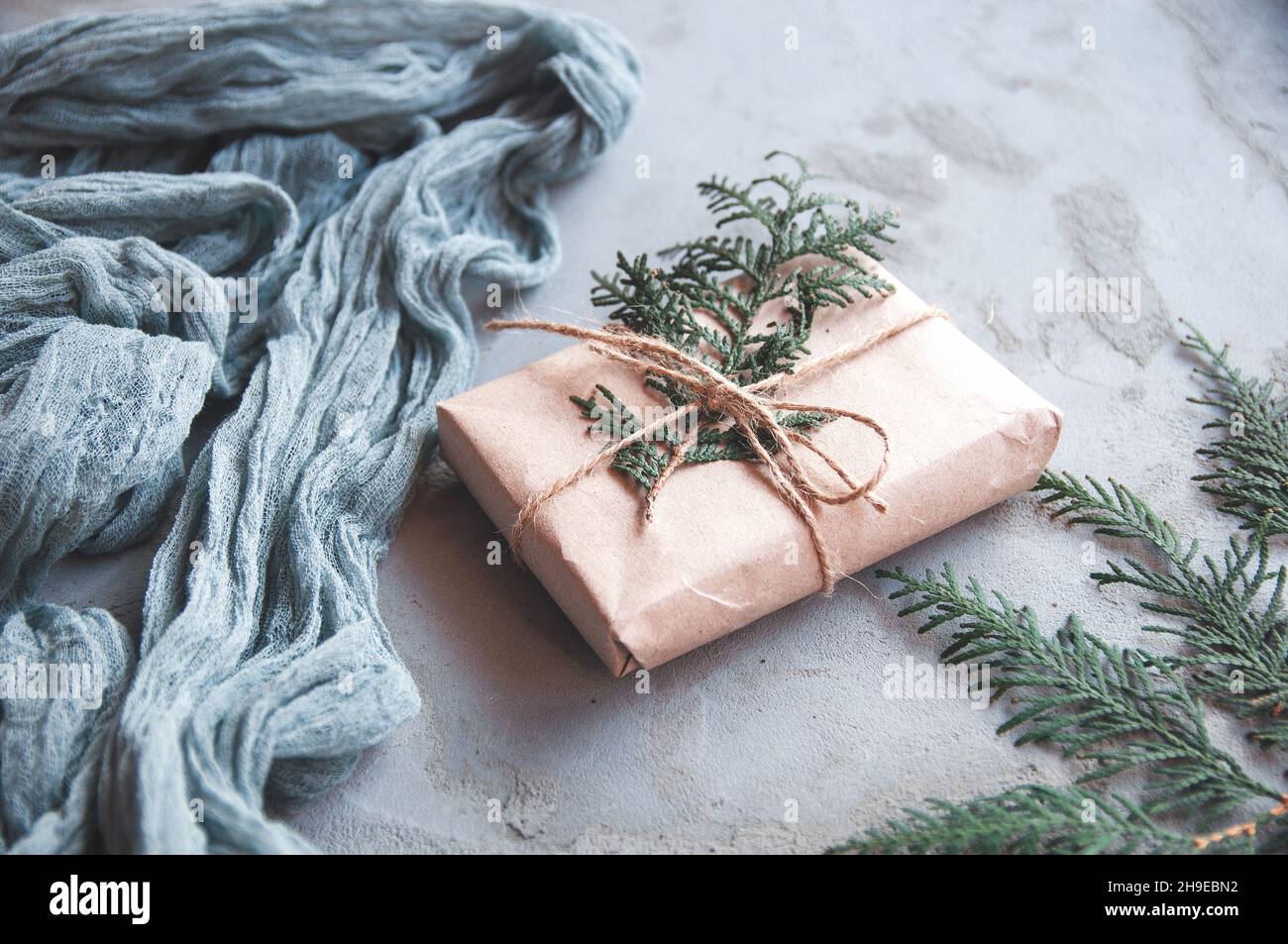 Kraft paper box beautiful blue gauze tablecloth on gray concrete ...