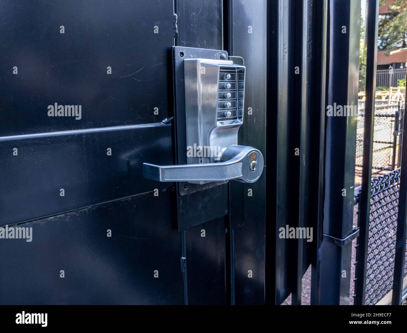View of a secure pin lock keypad on a door in a big city's downtown ...