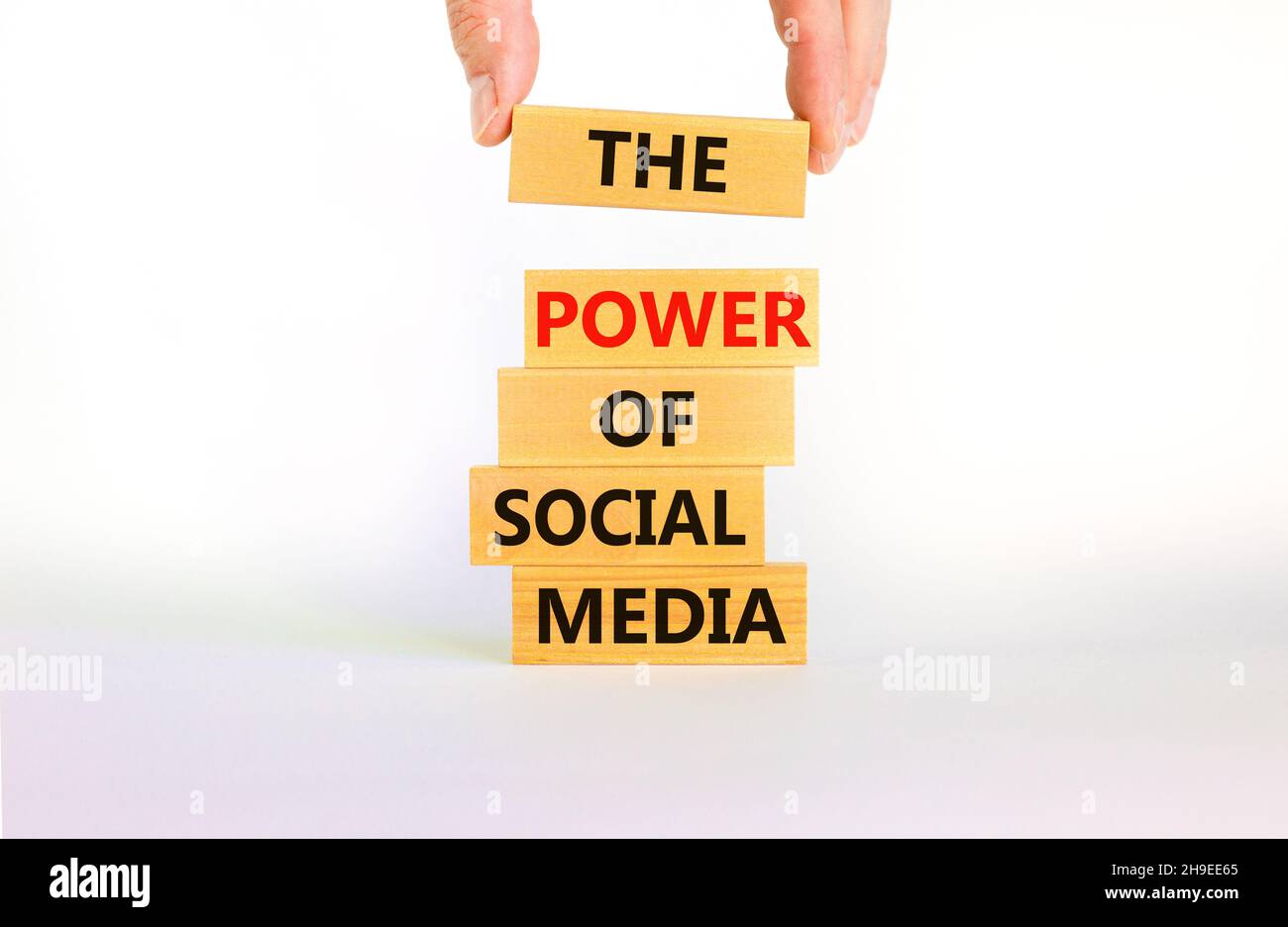 Power of social media symbol. Wooden blocks with words The power of ...