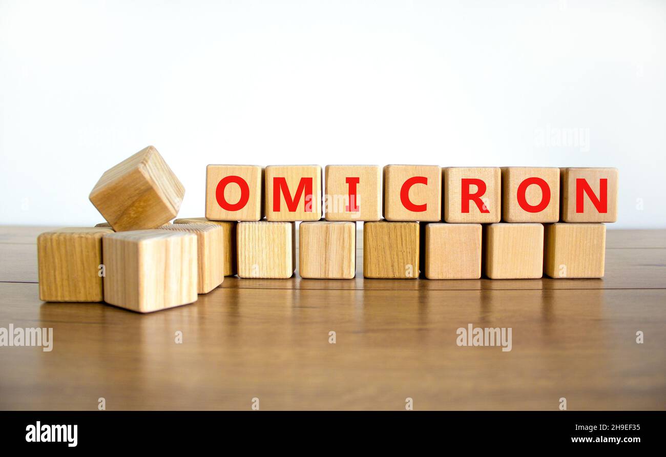 Covid-19 new omicron strain symbol. The concept word Omicron on wooden ...