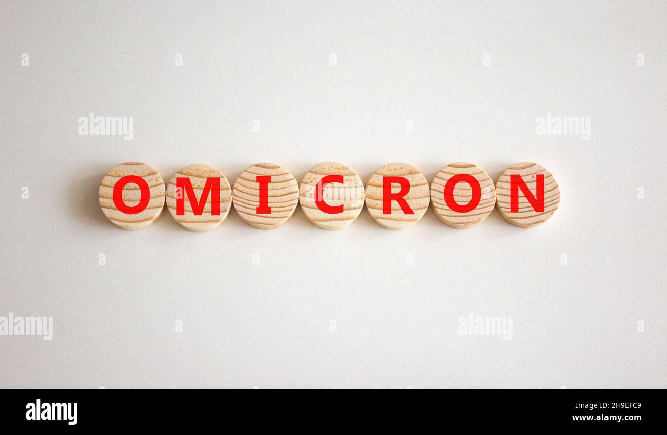 Covid-19 new omicron strain symbol. The concept word Omicron on wooden ...