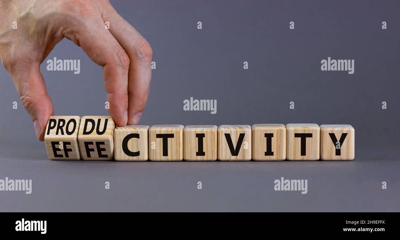 Effectivity and productivity symbol. Businessman turns cubes and ...
