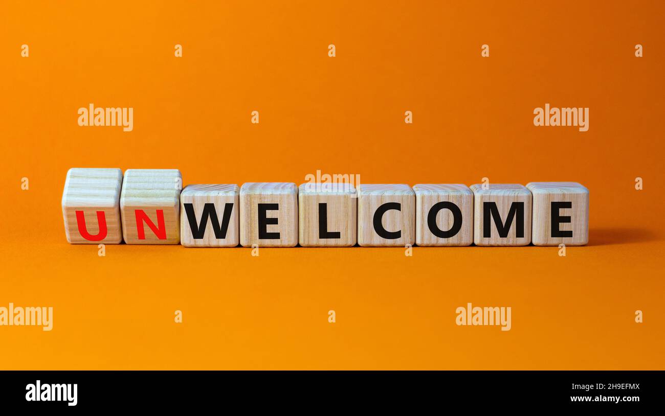 Welcome or unwelcome symbol. Turned wooden cubes and changed the word ...