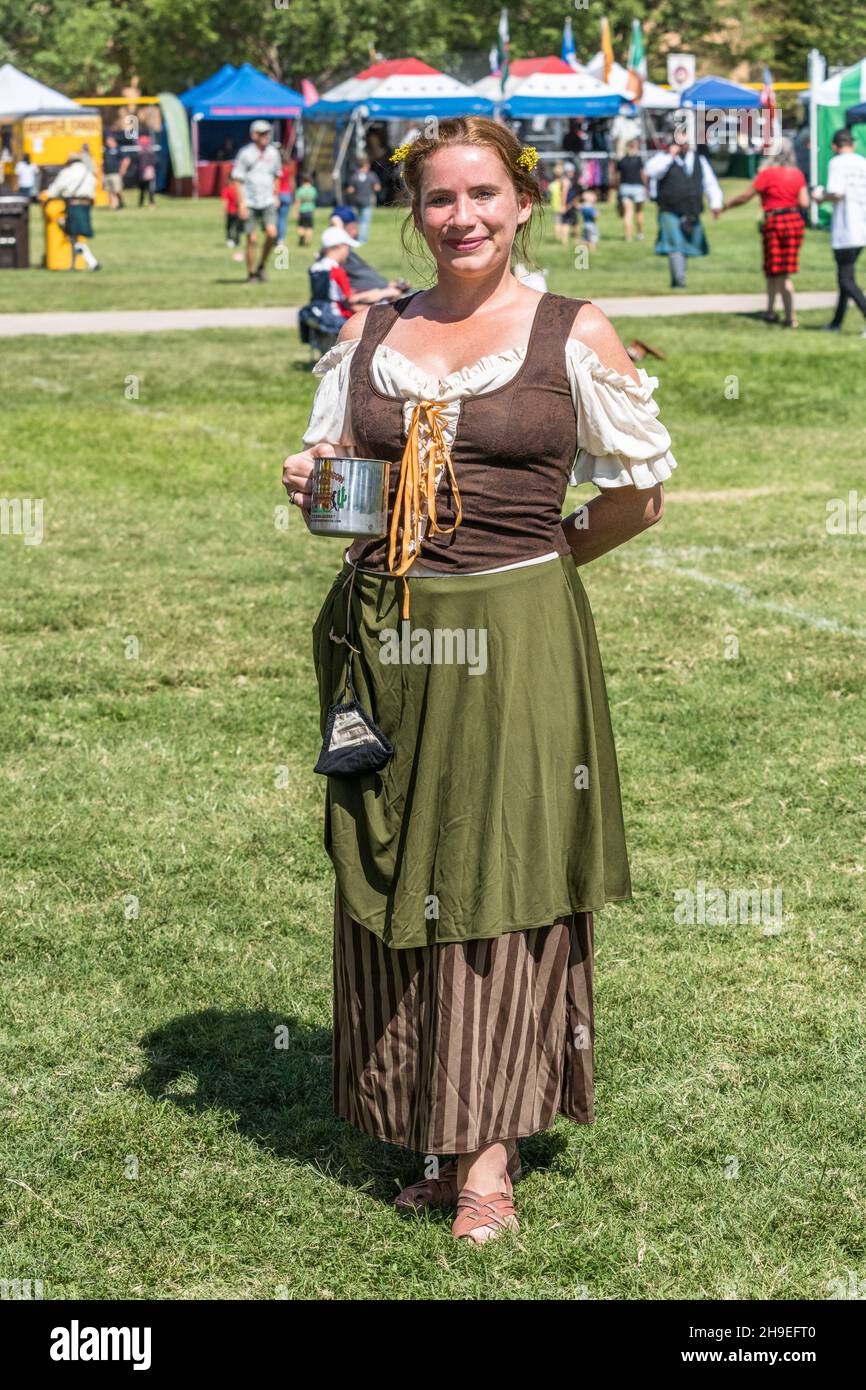 A woman dressed as a wench in period costume at a Scottish festival in ...