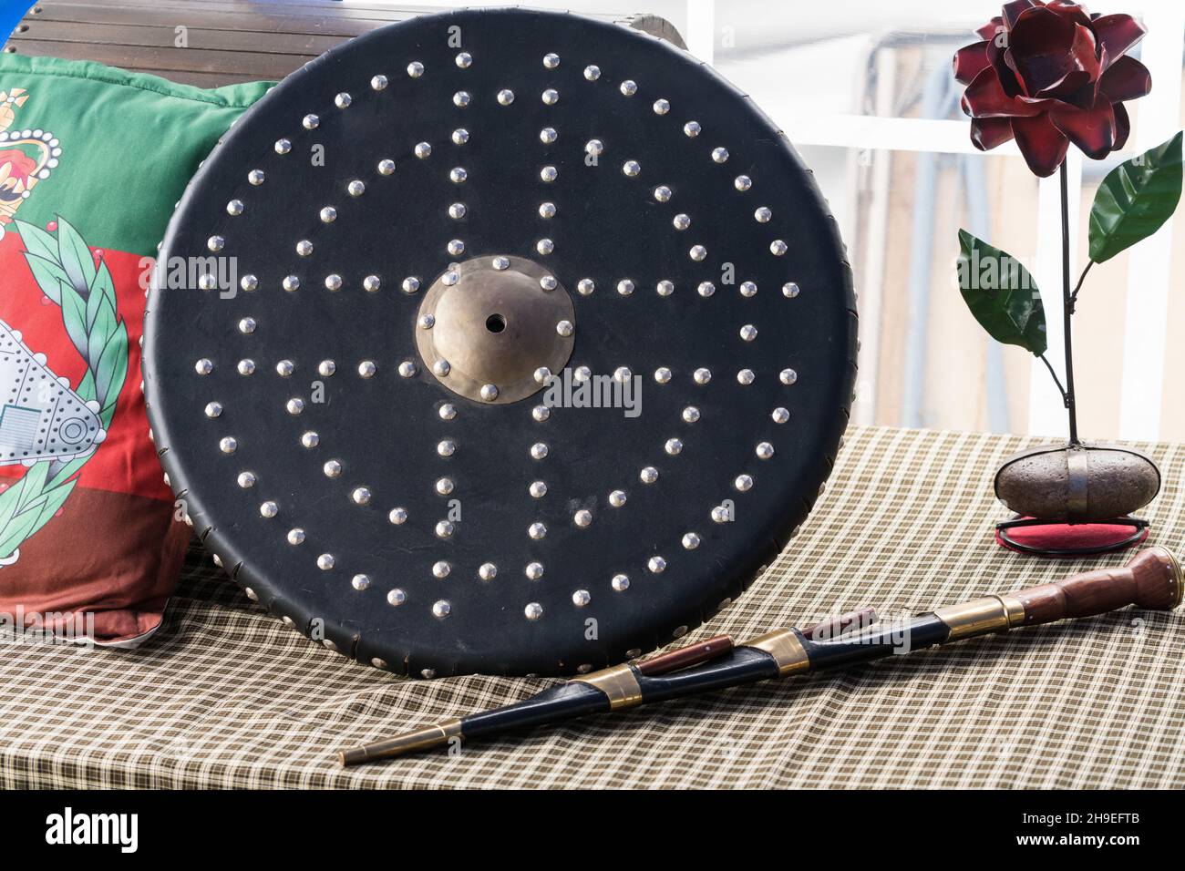 A Scottish targe or shield and a dirk or dagger on a table at a ...