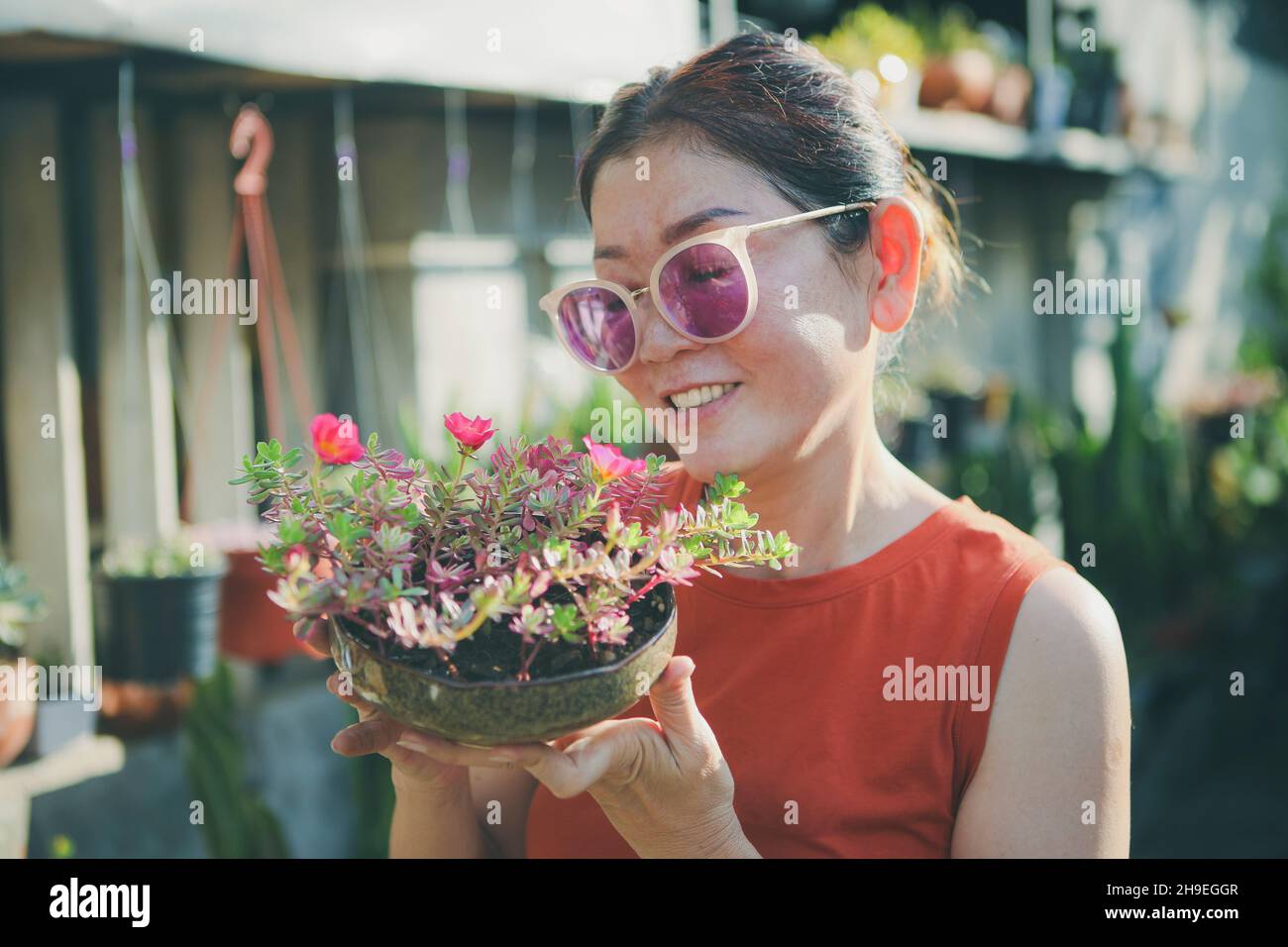 Beautiful woman raising pot hi-res stock photography and images - Alamy