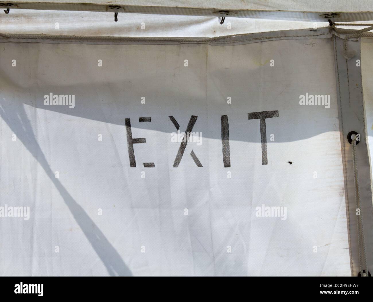 Exit sign or text printed on a canvas tent or marquee Stock Photo - Alamy