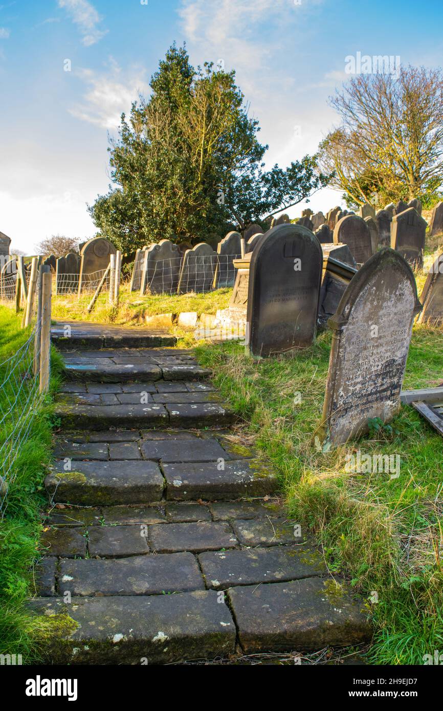 Stone steps next to ancient gravestones in Yorkshire England Stock ...