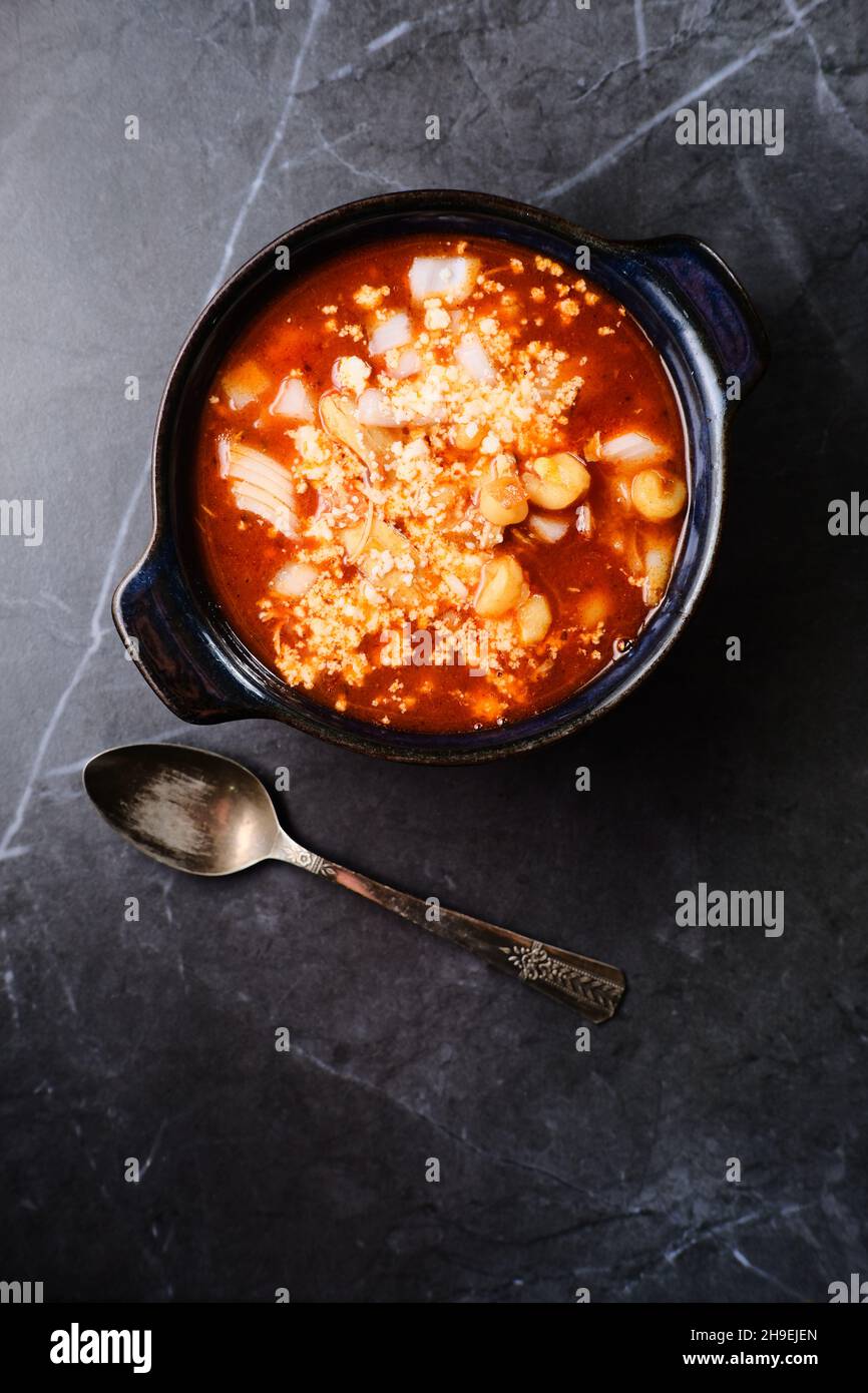 Mexican Pozole rojo chicken and hominy stew with crumbled cotija cheese ...