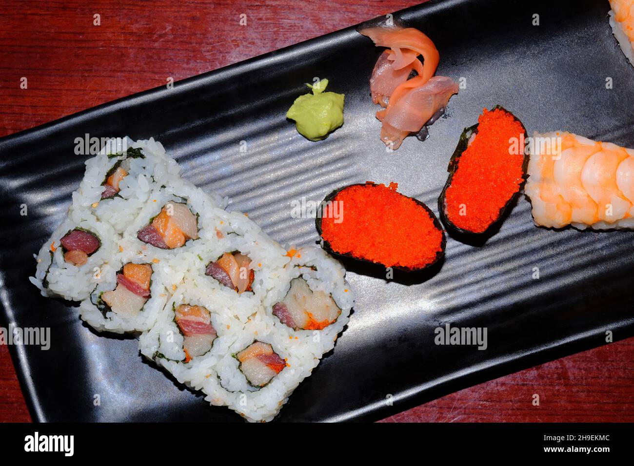 Japanese restaurant triple roll with tokiko and shrimp tail sushi Stock ...