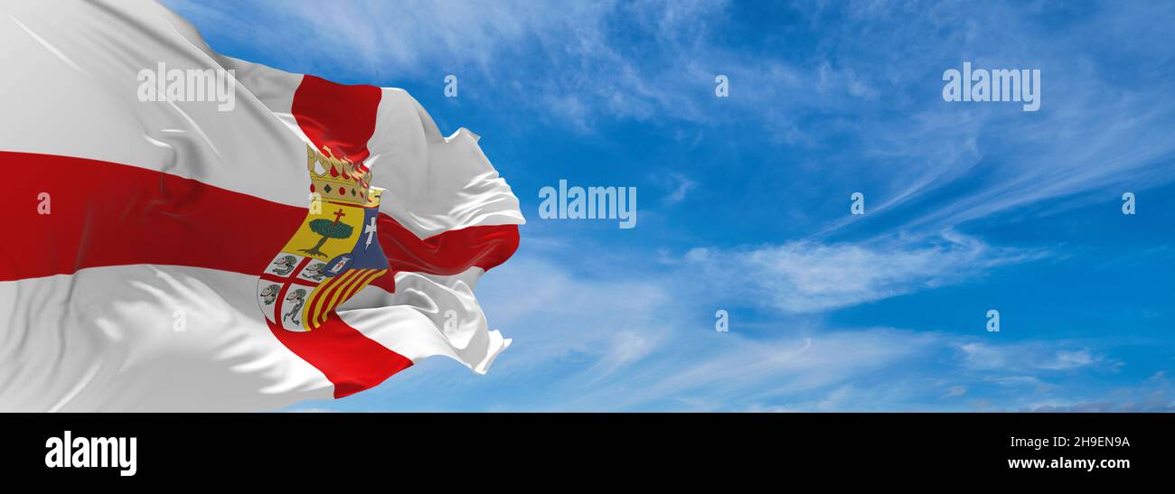 flag of Zaragoza province with coat of arms , Spain at cloudy sky ...