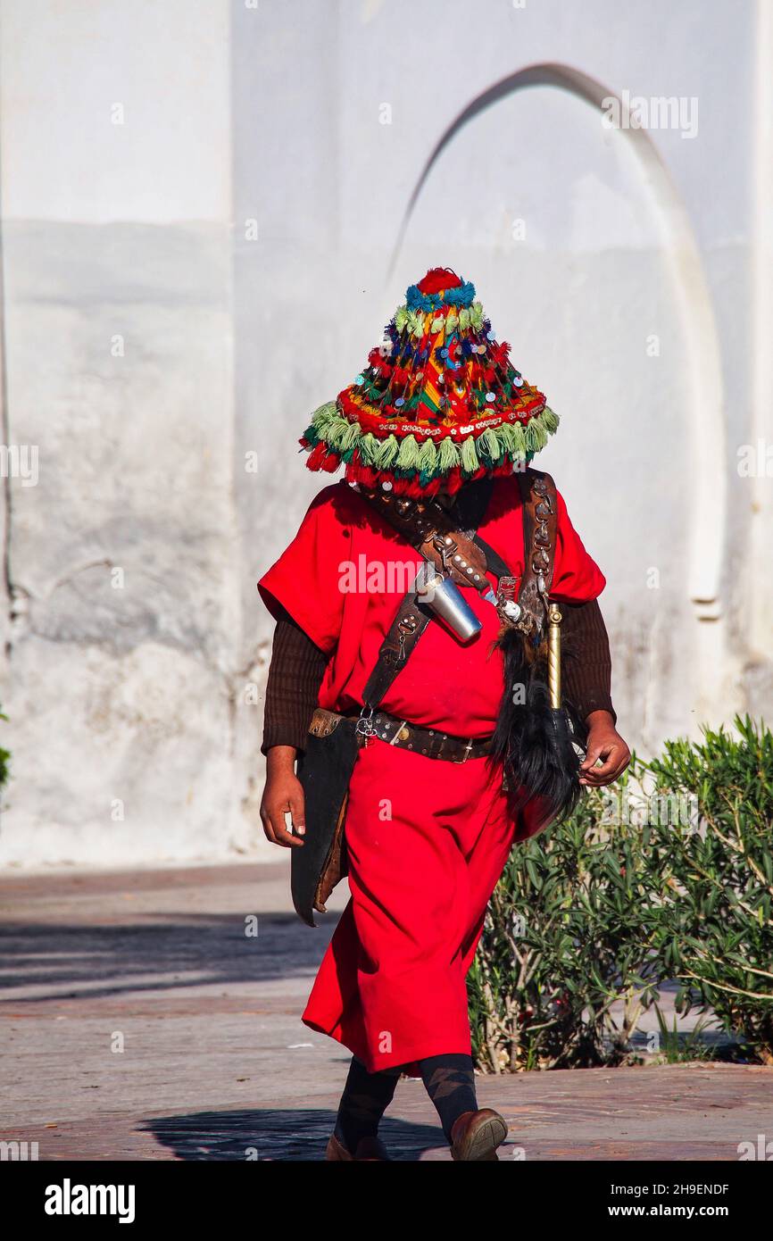 Traditional water seller in red uniform in the Djemma el Fna, Marrakech ...
