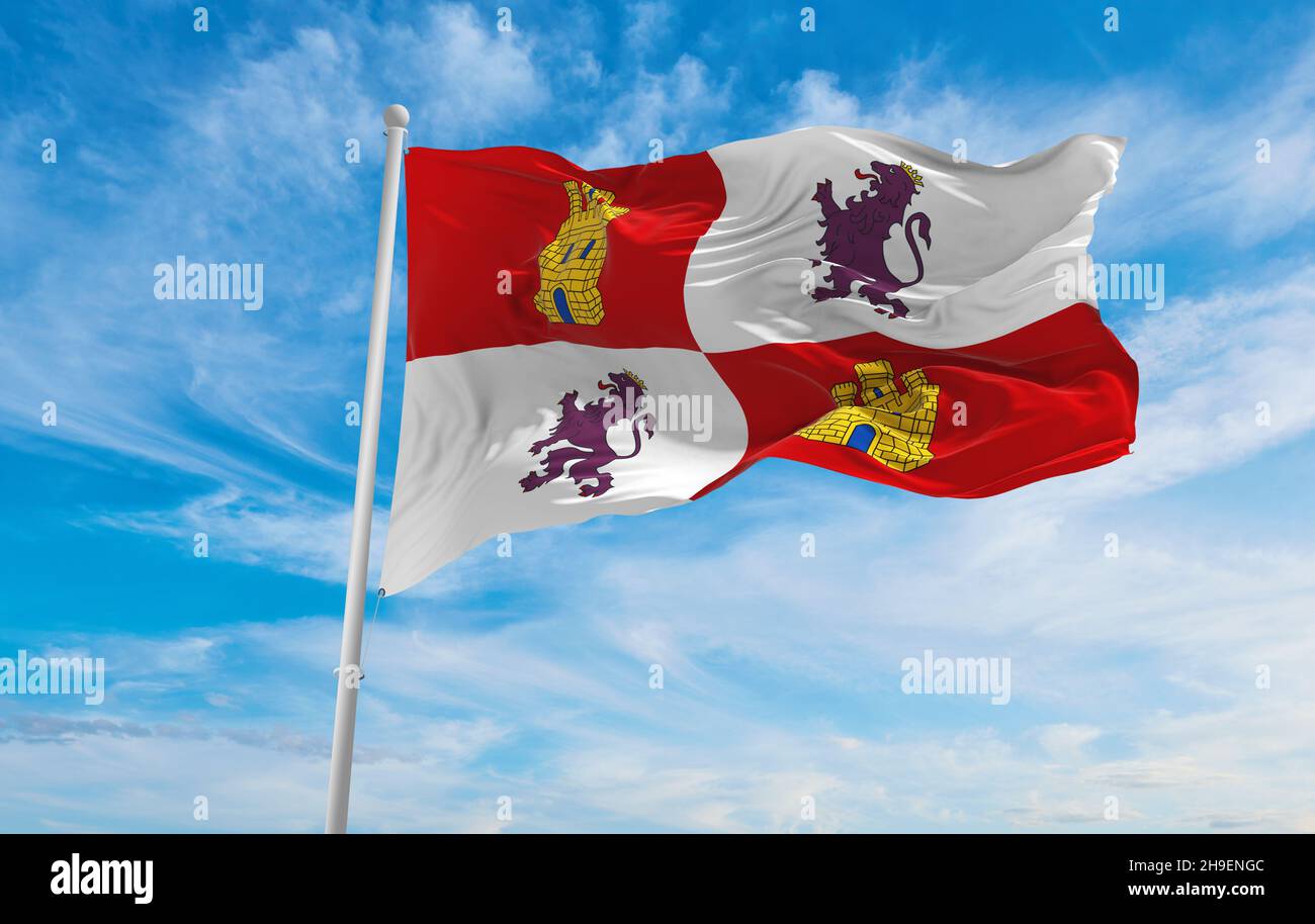 flag of Castile and Leon , Spain at cloudy sky background on sunset ...