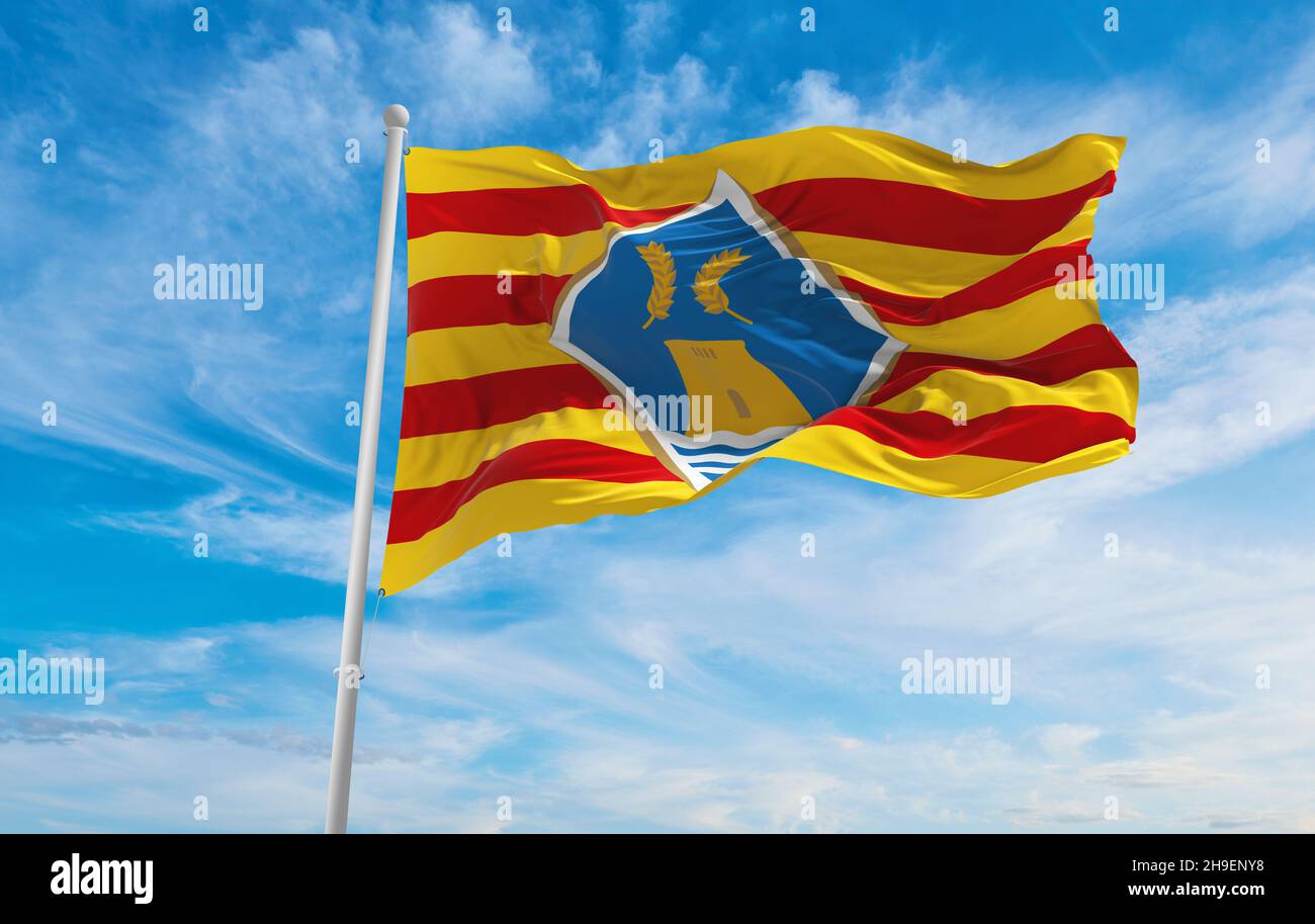 flag of Formentera , Spain at cloudy sky background on sunset ...