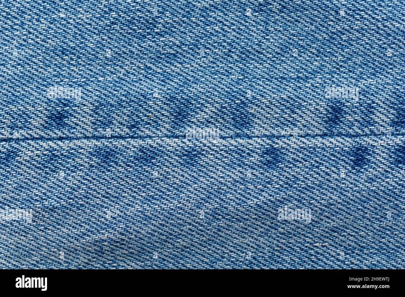 Jeans close up background. Denim stitching. Blue fabric Stock Photo - Alamy