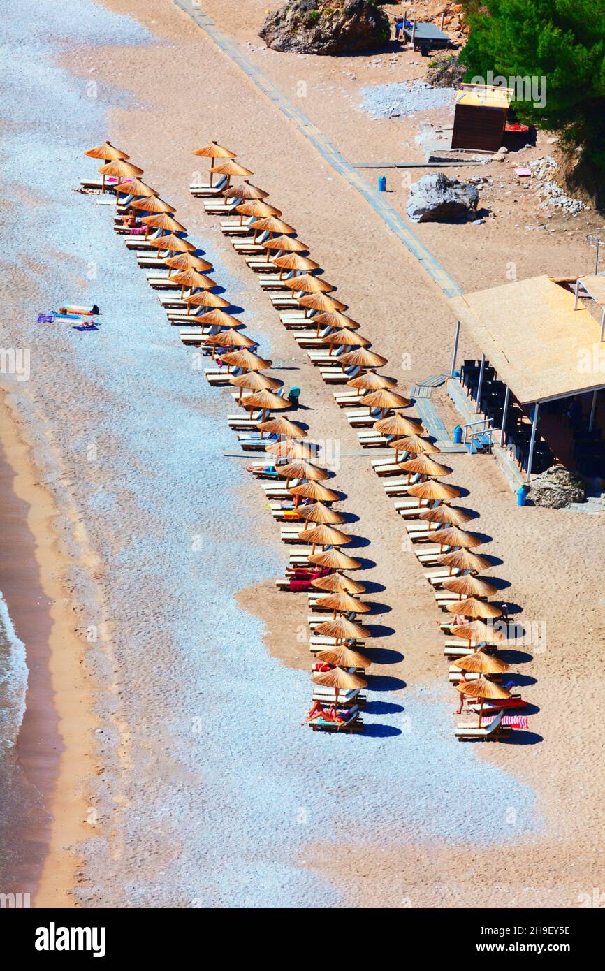 Aerial top view by drone of tropical beach . Sandy beach with umbrellas ...