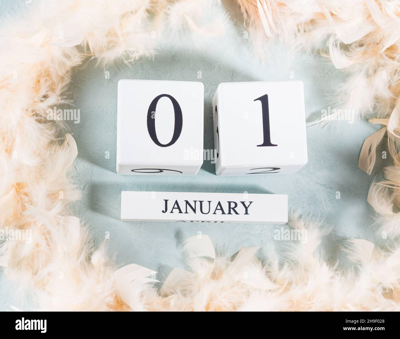 Calendar January, 1 date on turquoise background in feather frame Stock ...