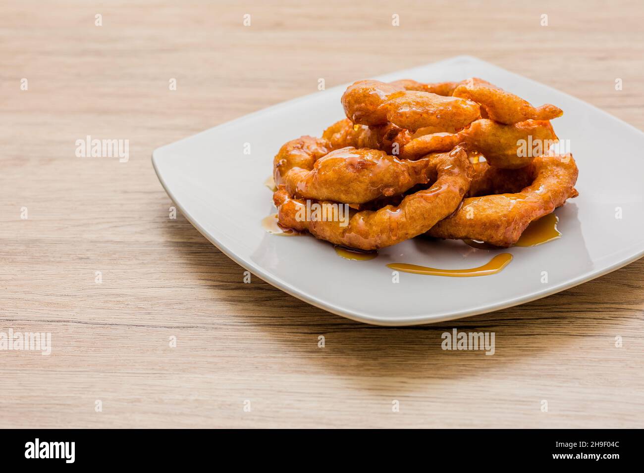 Picarones Peruvian traditional snack delicious food with honey Stock ...