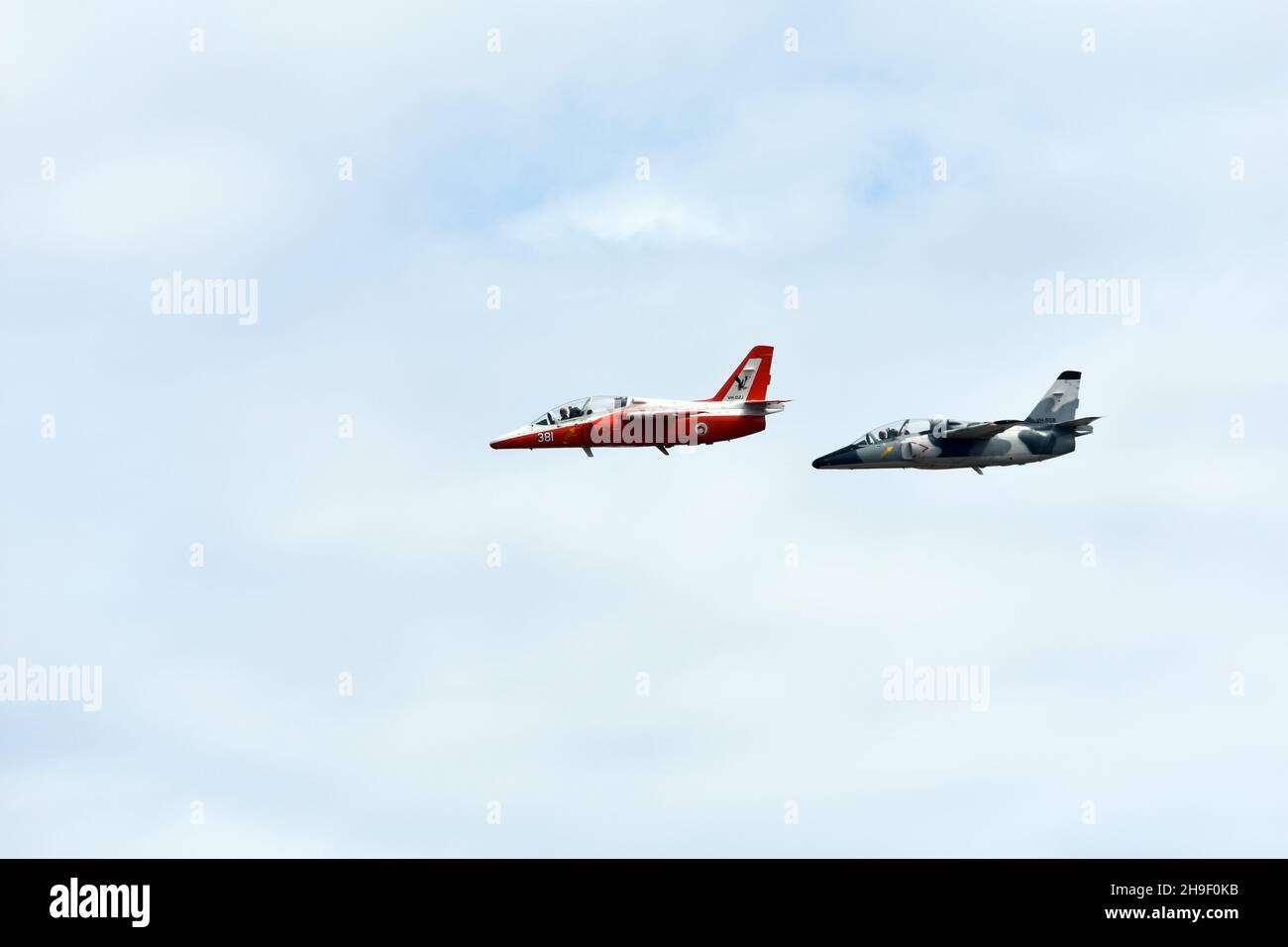 Two jet aircraft flying in formation at an airshow Stock Photo - Alamy