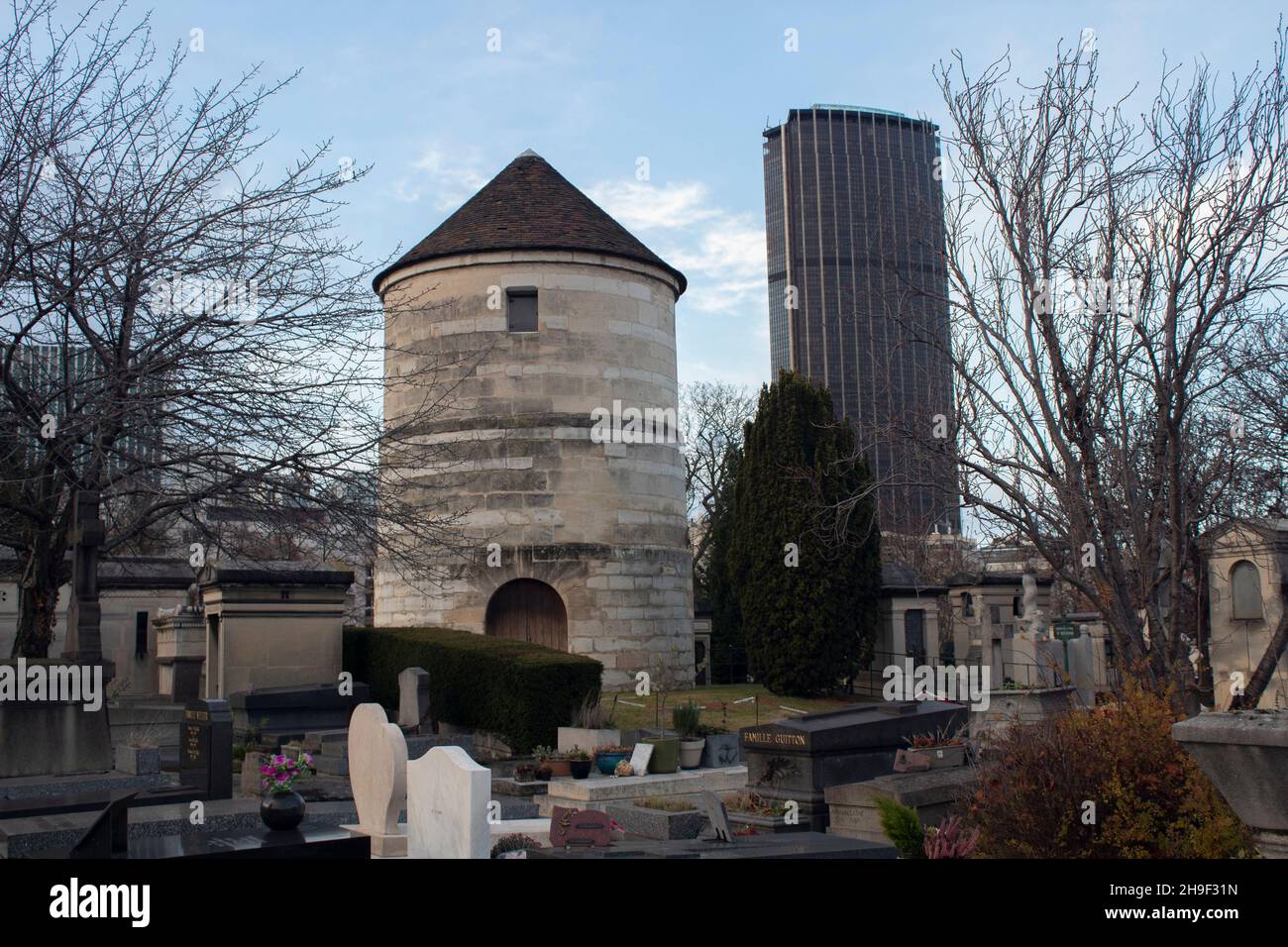 The windmill without its sails in the Montparnasse Cemetery, with the ...