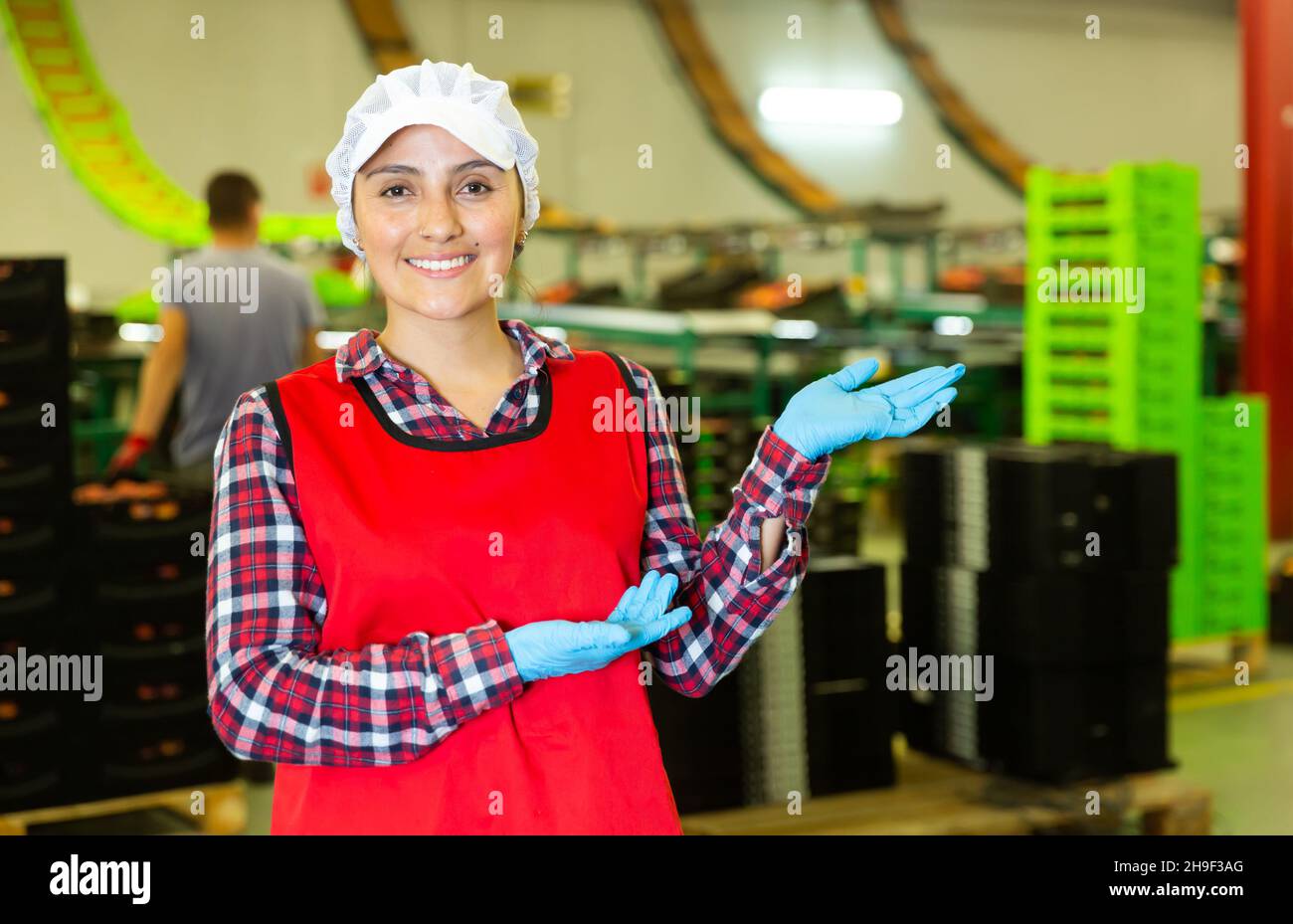 Woman offers to inspect automatic fruit sorting line at factory ...