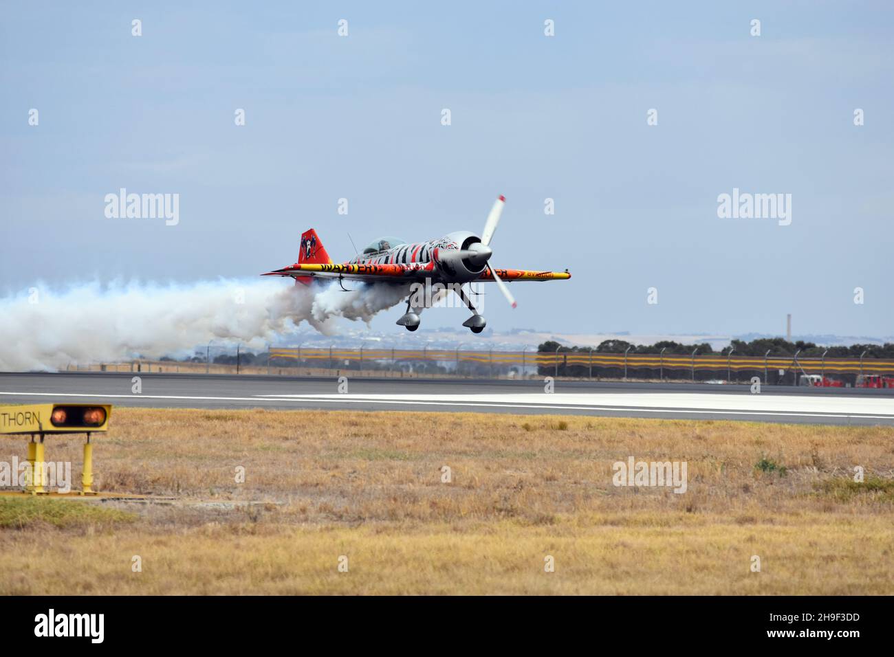 Low flying aerobatical aircraft Stock Photo - Alamy