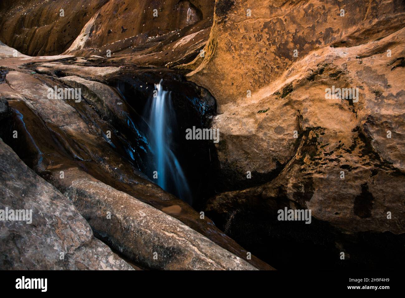 Pure, clean water trickles through the sandstone of high mountain ...