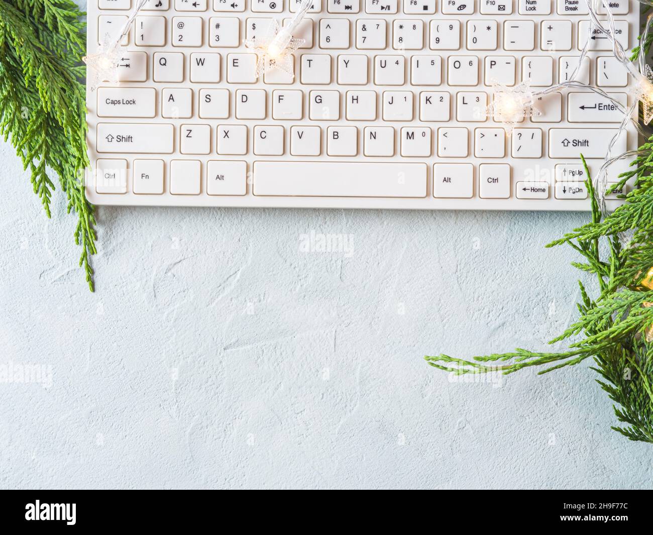 Workplace winter background with keyboard on gray background with ...