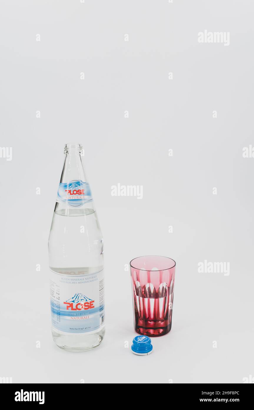 INVERIGO, ITALY - Dec 04, 2021: light natural water glass bottle and ...