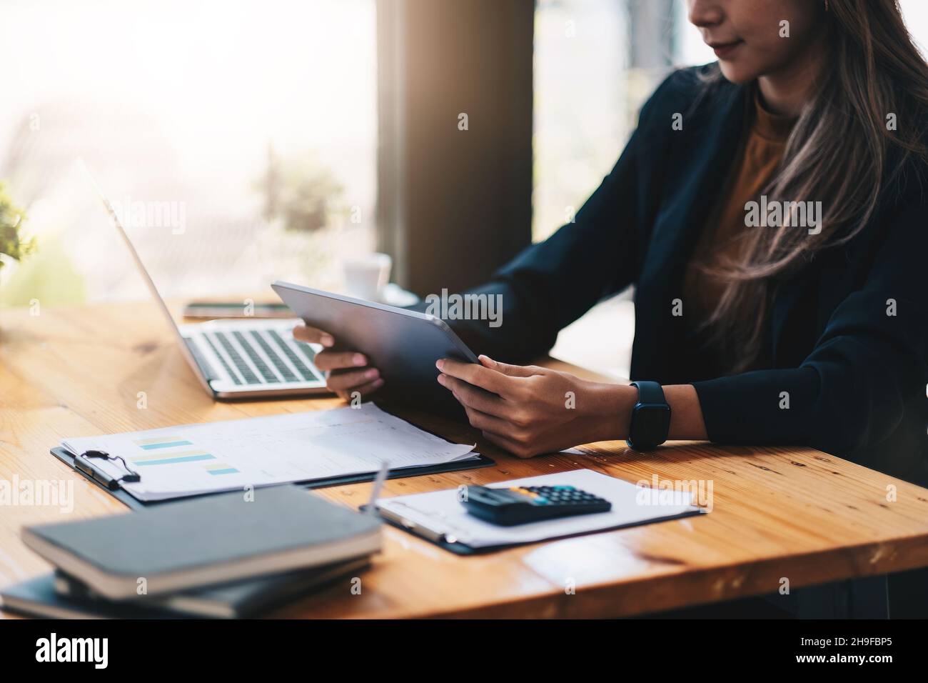 Asian businesswoman investment consultant analyzing company annual ...