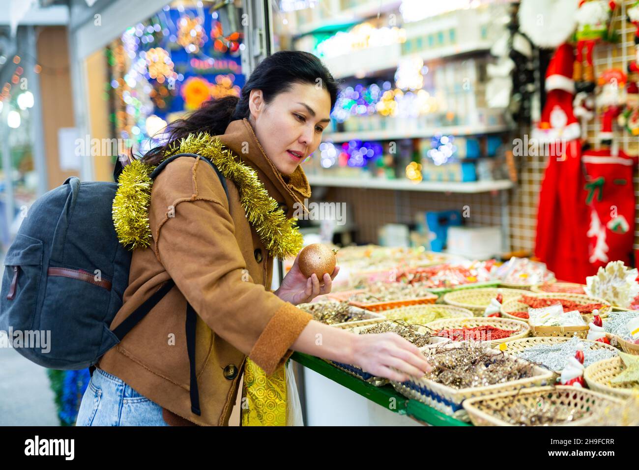 Asian female choosing decorations hi-res stock photography and images ...