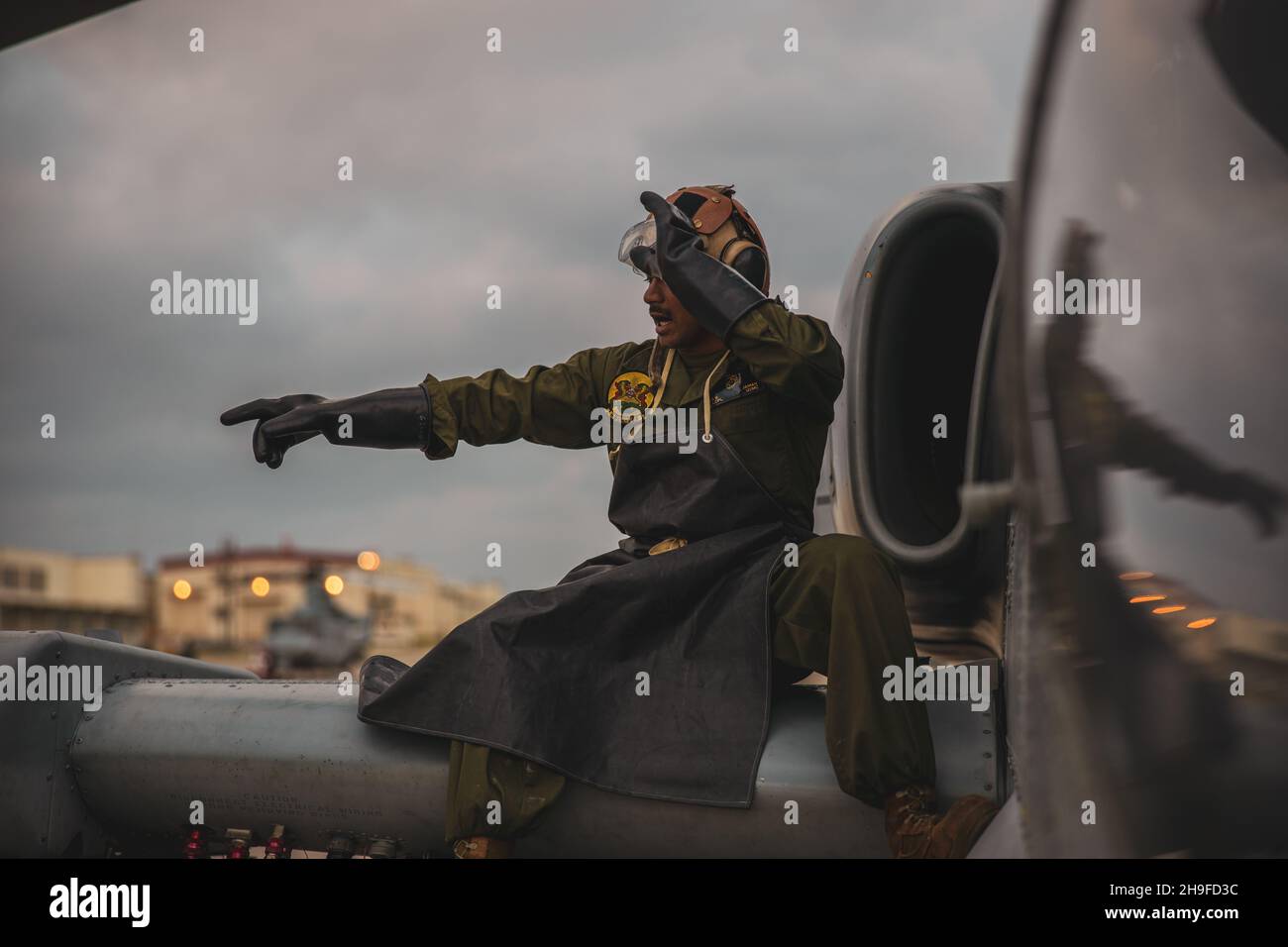 A U.S. Marine with Marine Light Attack Helicopter Squadron (HMLA) 369 ...