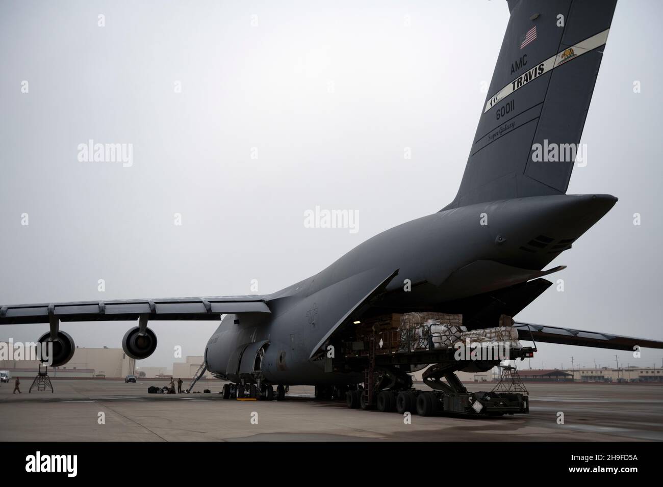 U.S. Airmen assigned to the 60th Aerial Port Squadron and 312th Airlift ...