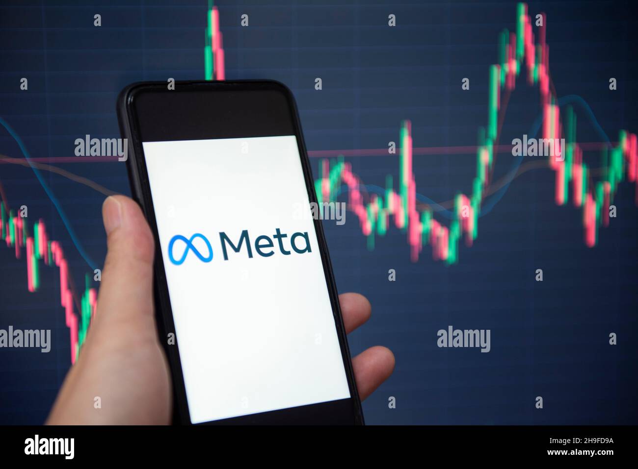 META logo on smartphone screen with hand hold and crypto currency or ...
