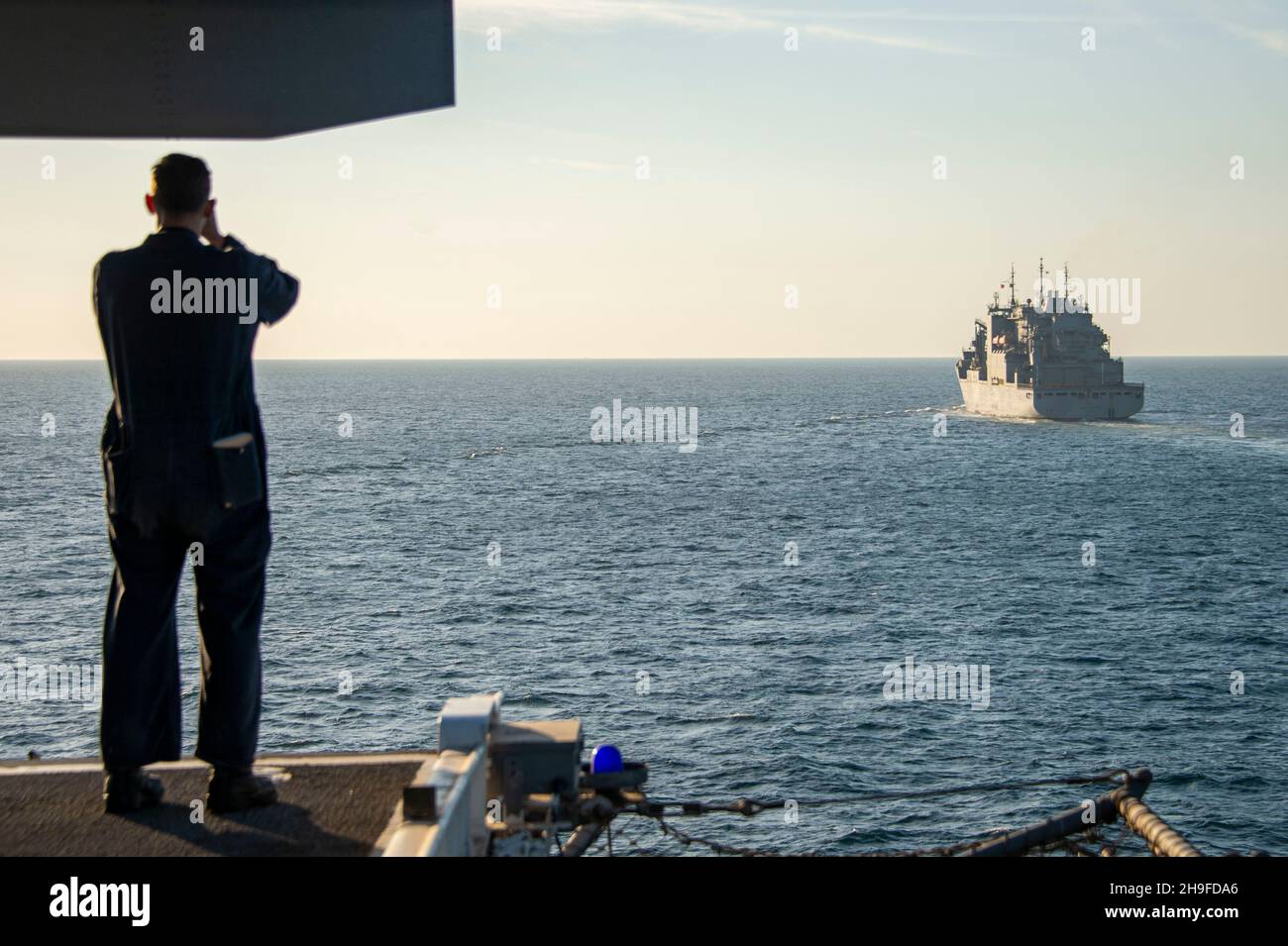 ARABIAN GULF (Dec. 5, 2021) Lt. j.g. Gage Murphy uses a rangefinder ...