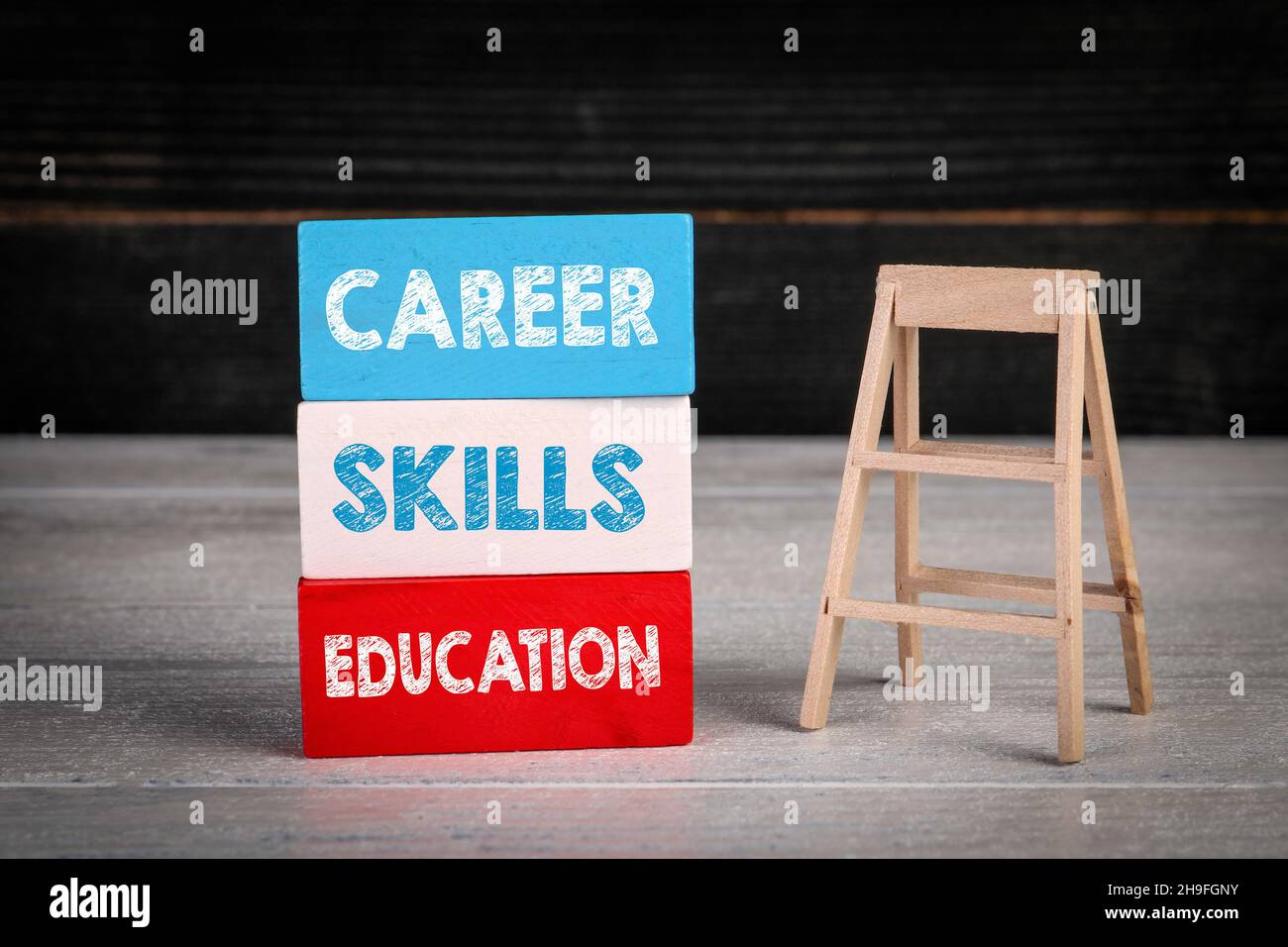Career, Skills an Education concept. Colored wooden blocks in a pile ...