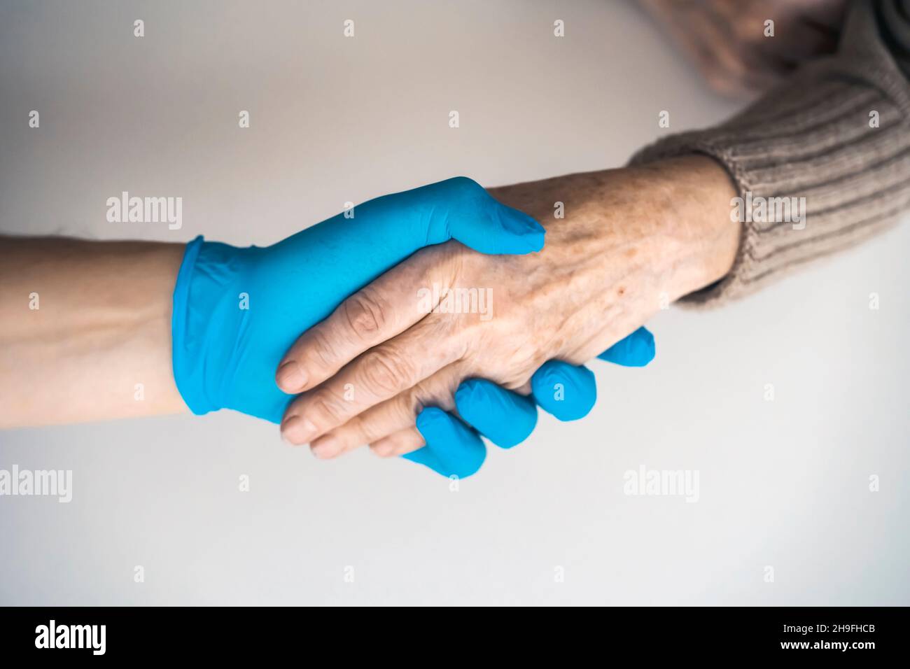 Handshake, caring, trust and support Stock Photo - Alamy